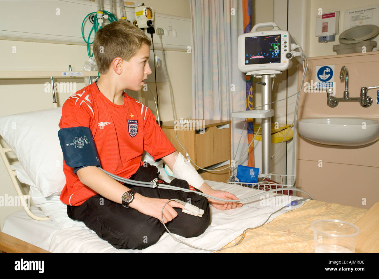 Blood pressure and pulse monitoring on young boy in hospital Stock ...