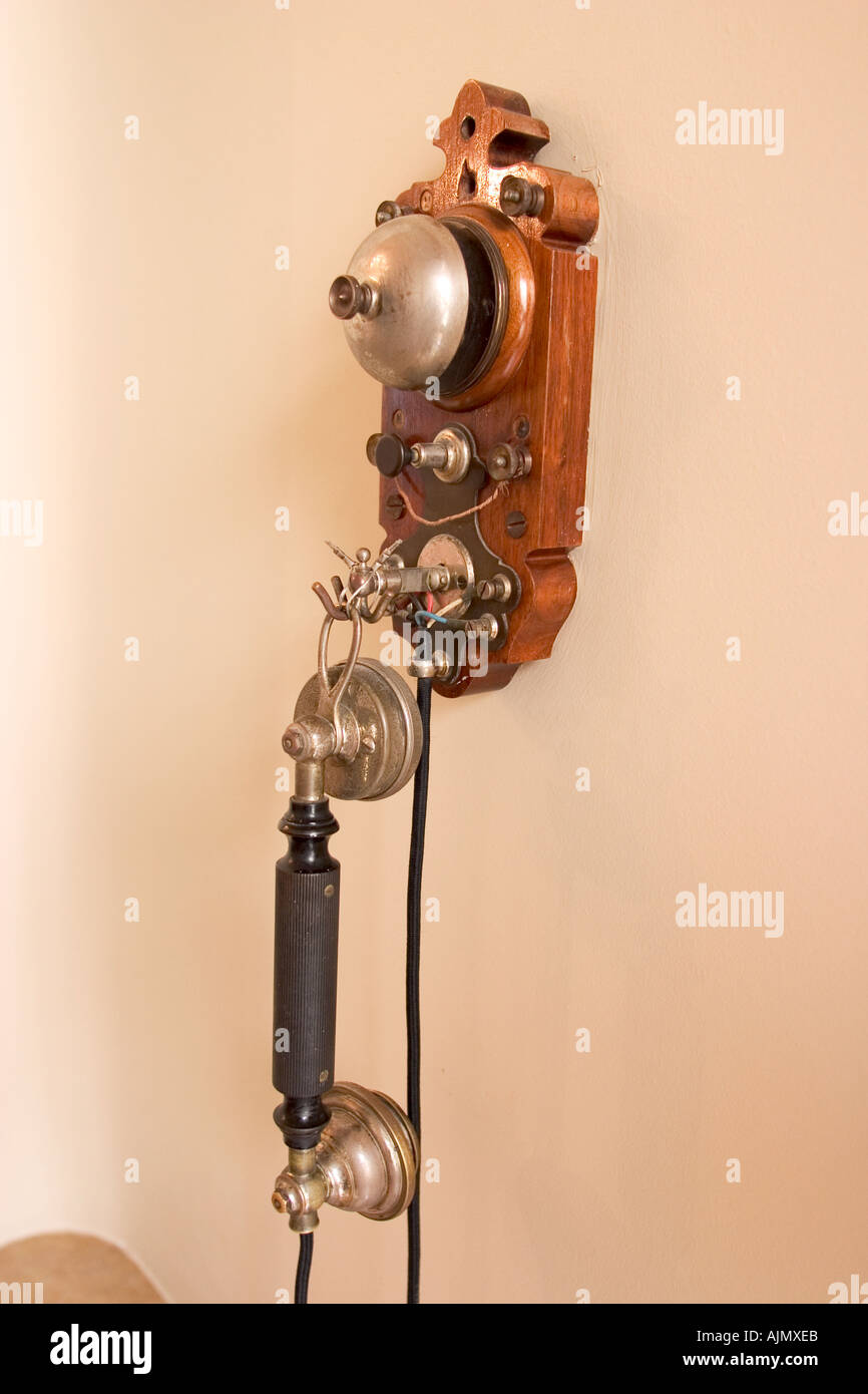 Old spanish wall hung telephone Stock Photo - Alamy