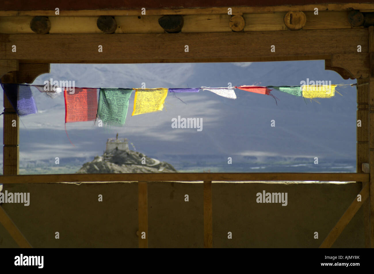 Tibetan buddhist prayer flags window temple flapping wind Leh Ladakh ...
