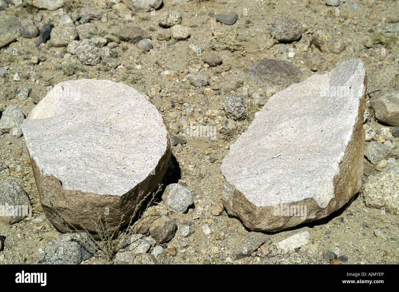 Broken boulder stone rock two parts split pebble Stock Photo - Alamy