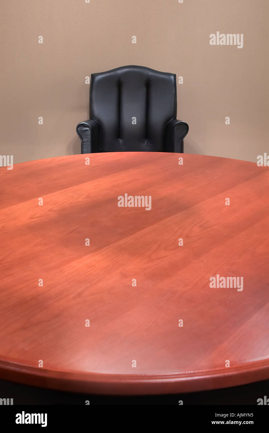 Lone chair at Round Table Stock Photo - Alamy