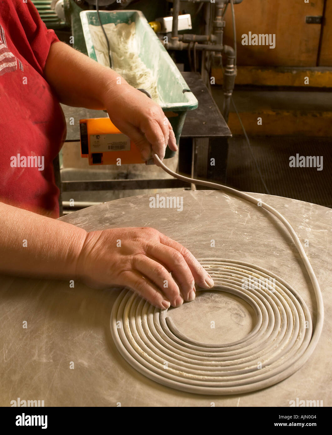 The Hands Of An Employee Worker Placing Gasket Material In A Coil, USA ...