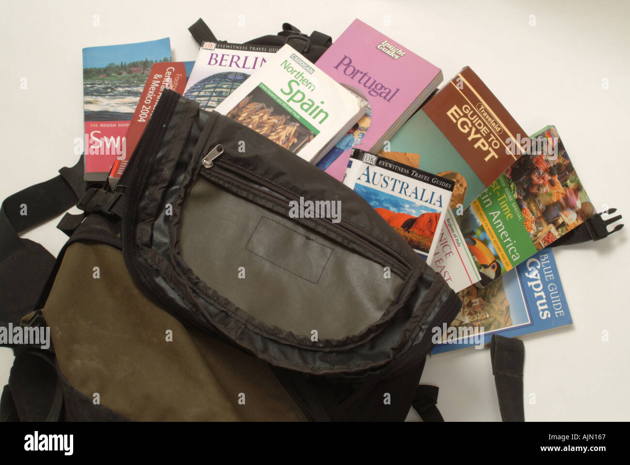 Travel guides in rucksack Stock Photo - Alamy