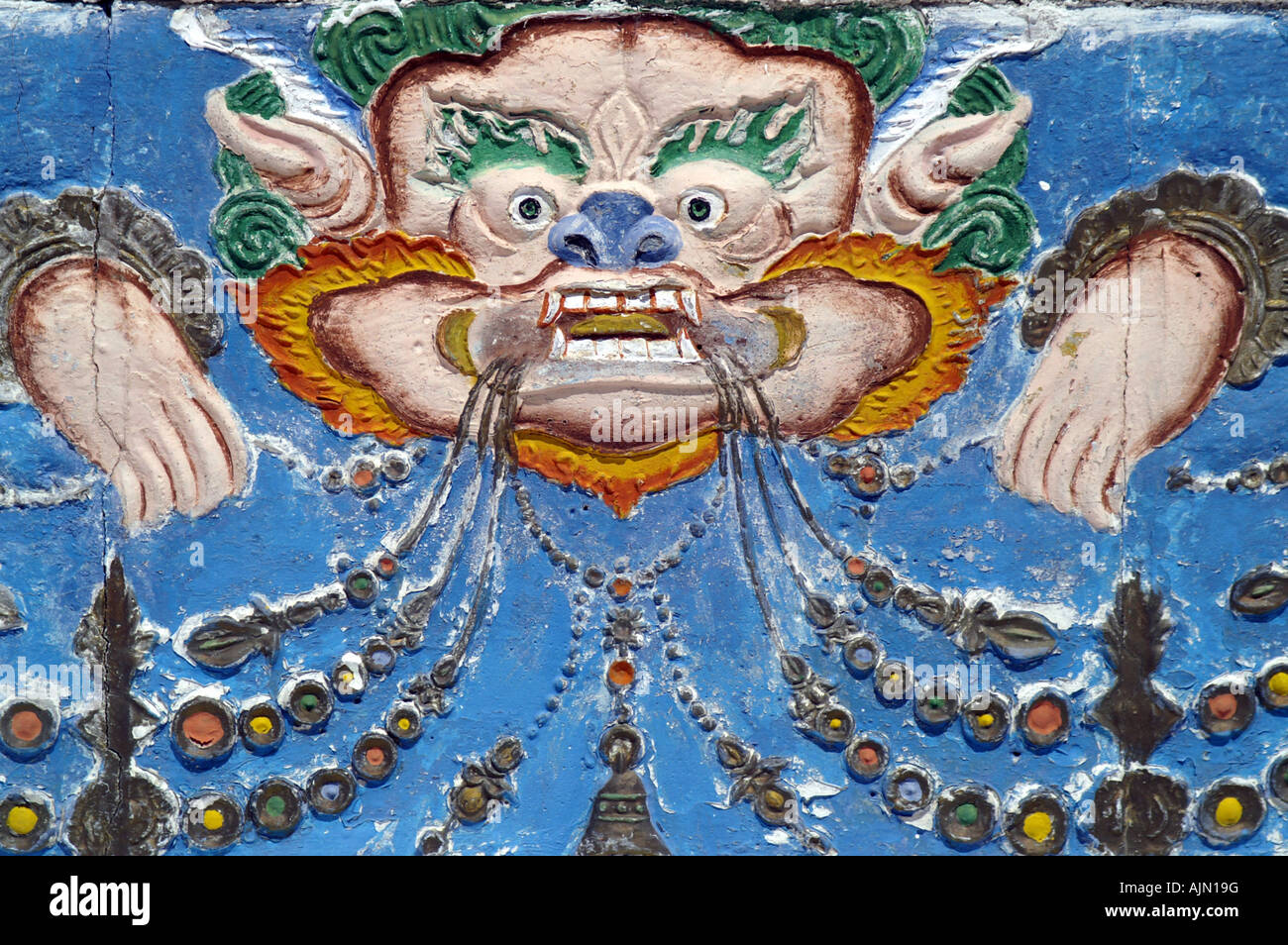 Tibetan buddhist deity face mural relief art, Shanti Stupa detail, Leh ...