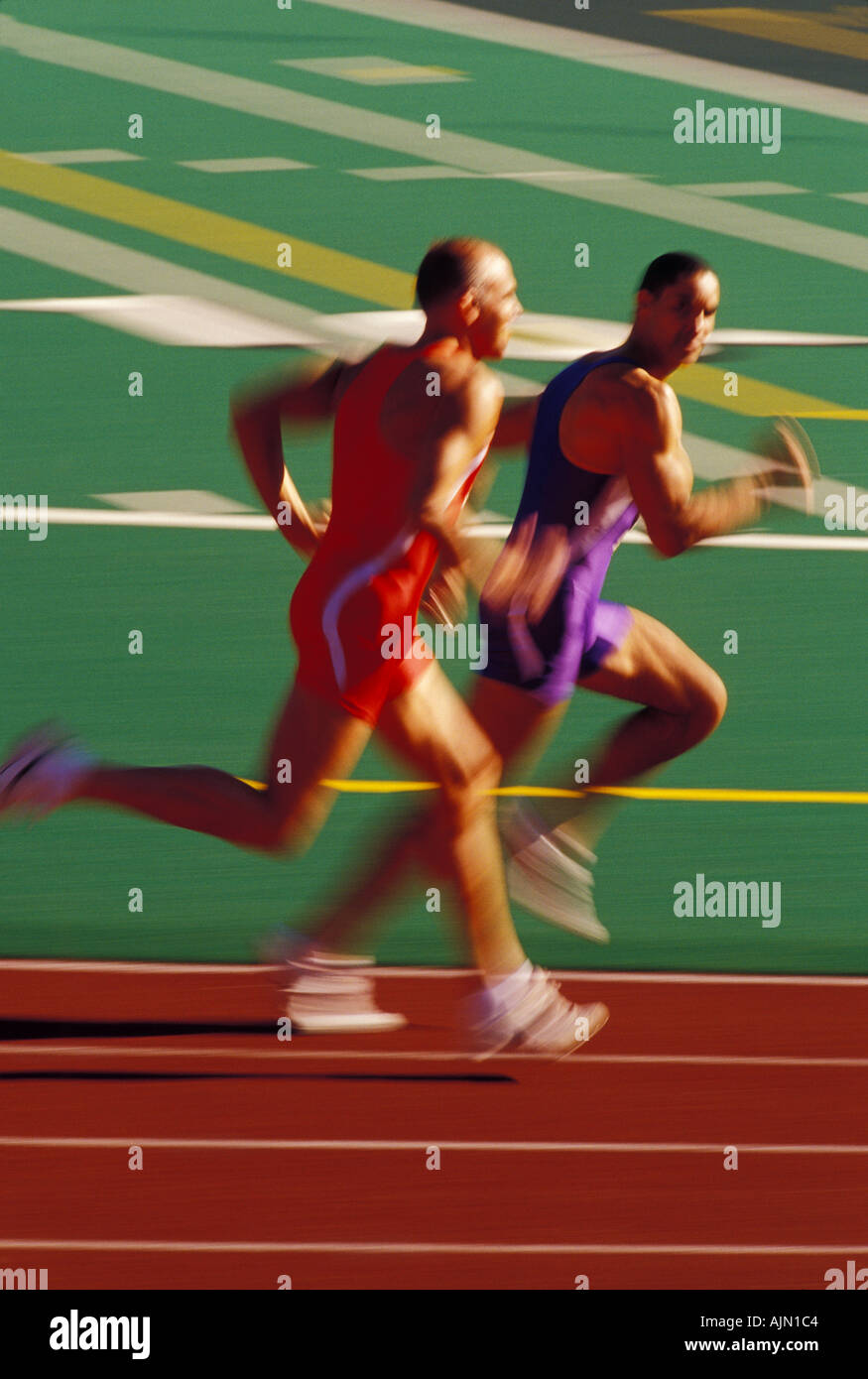 A sprinter looks over his shoulder at his nearest competitor Stock ...