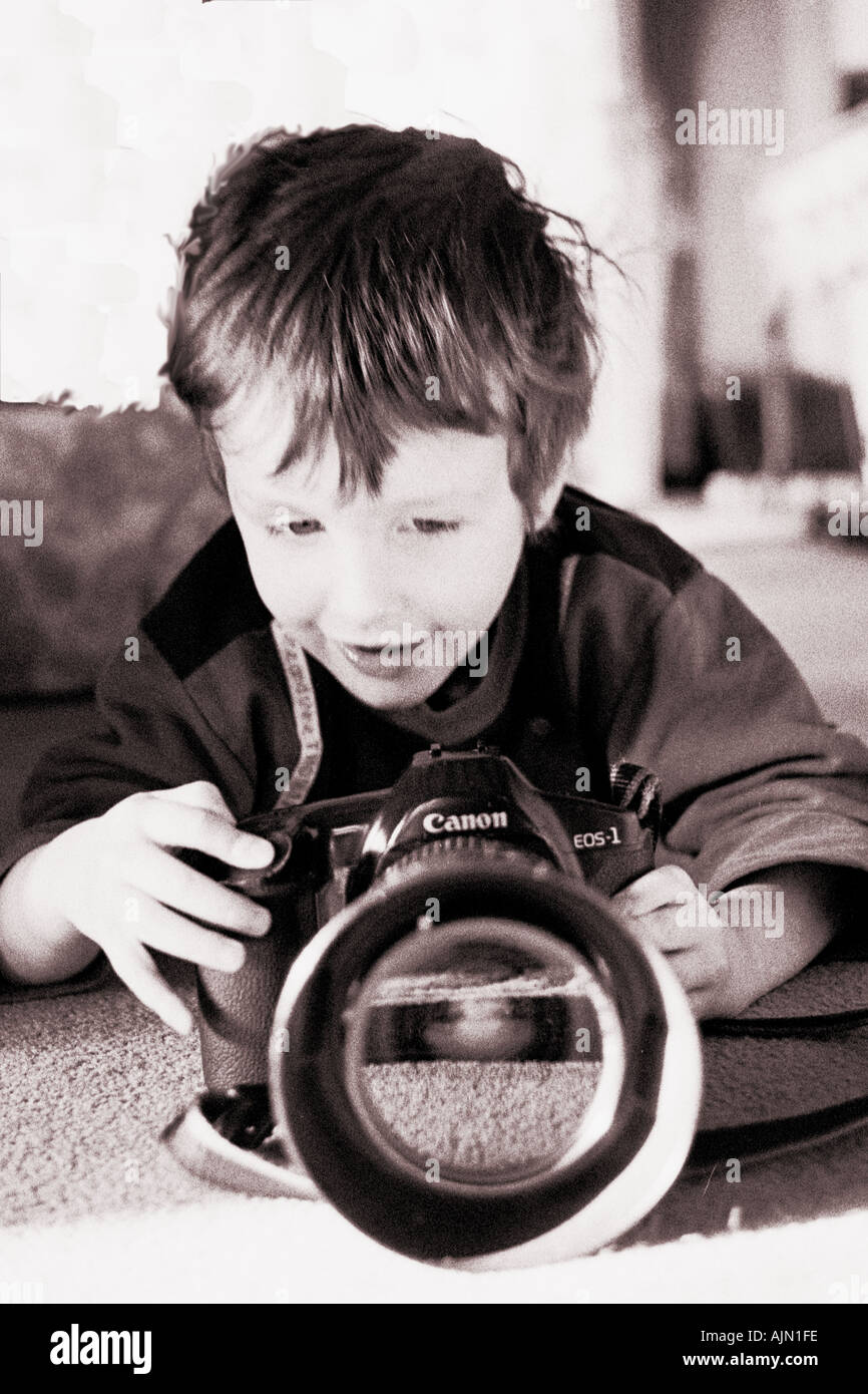CHILD PLAYING WITH CAMERA Stock Photo - Alamy