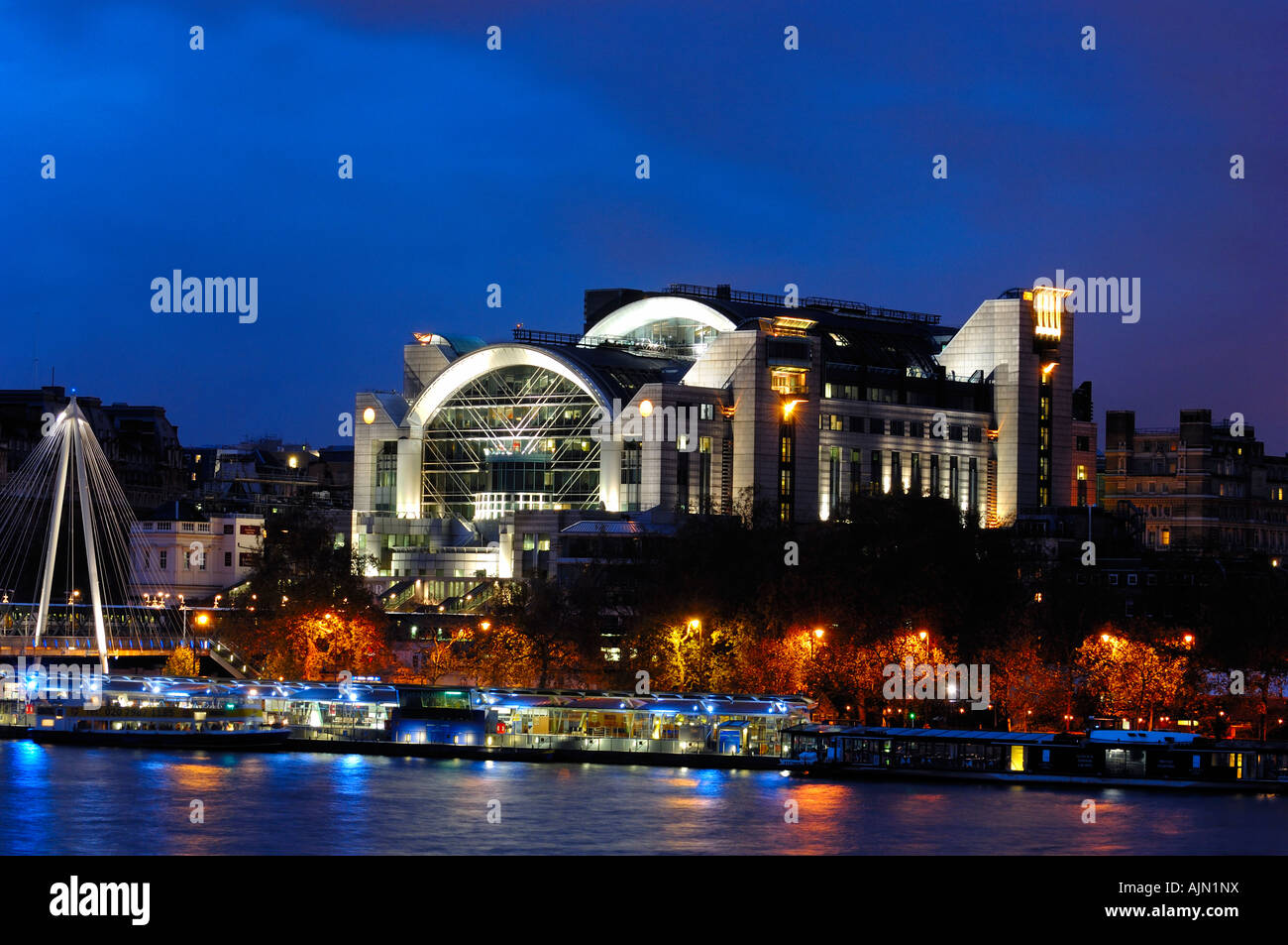 king's cross railway station at night from across river thames england ...