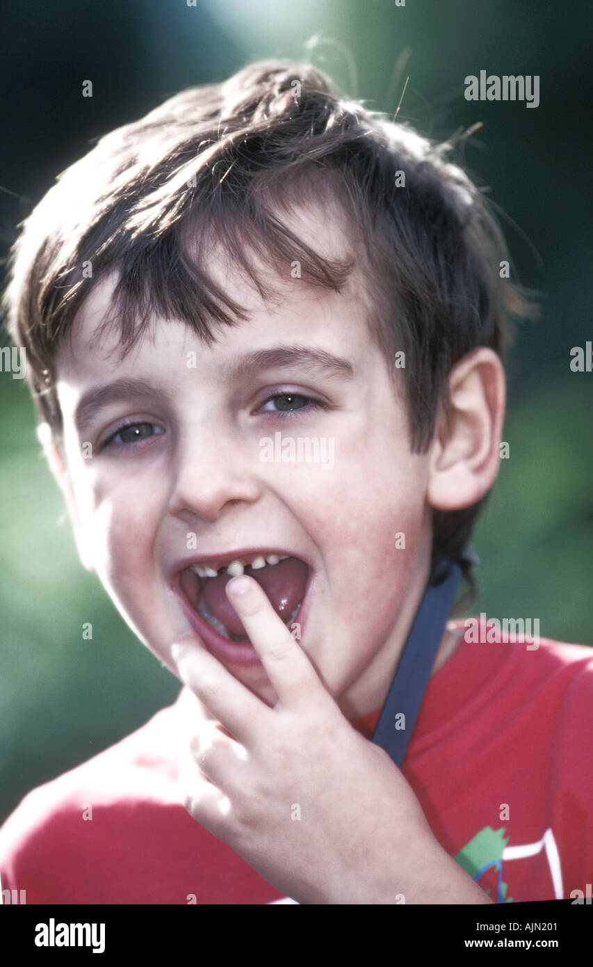 BOY SHOWING GAP IN FRONT TEETH Stock Photo - Alamy