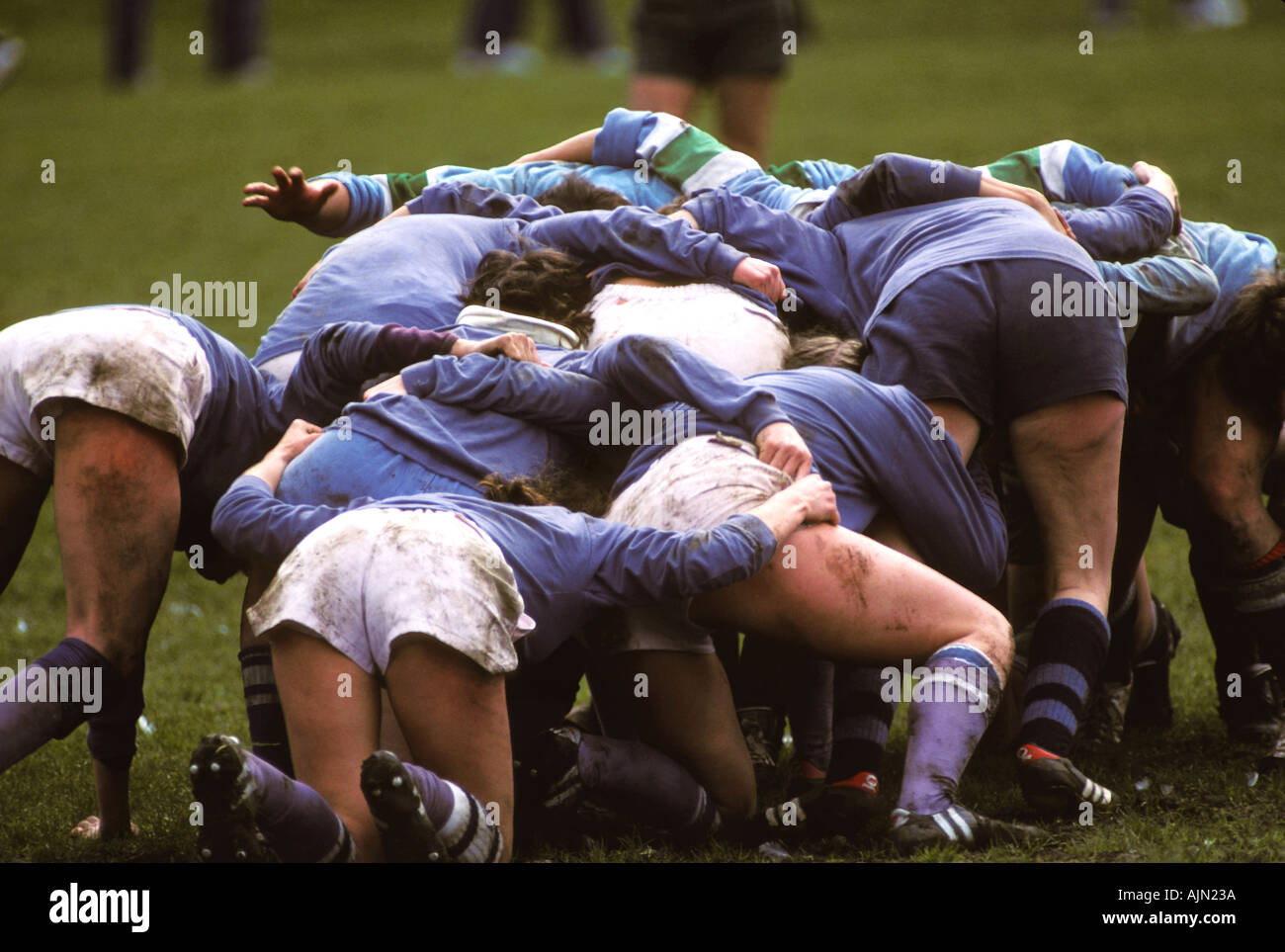 Women s rugby scrum on a muddy field Stock Photo - Alamy