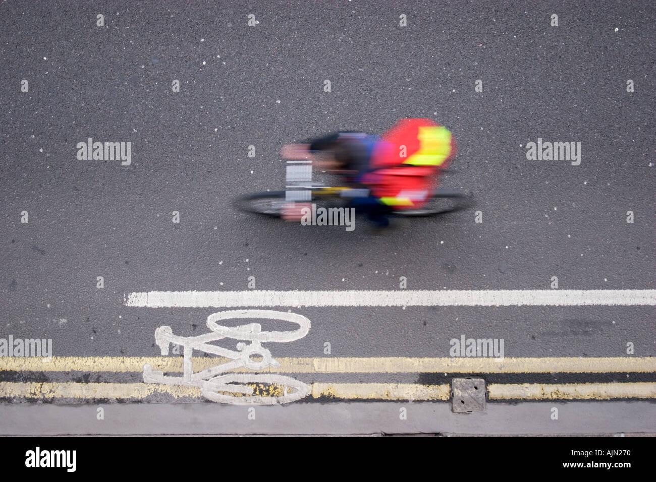 Royal mail postman Cyclist symbol in road with bike rider passing at ...