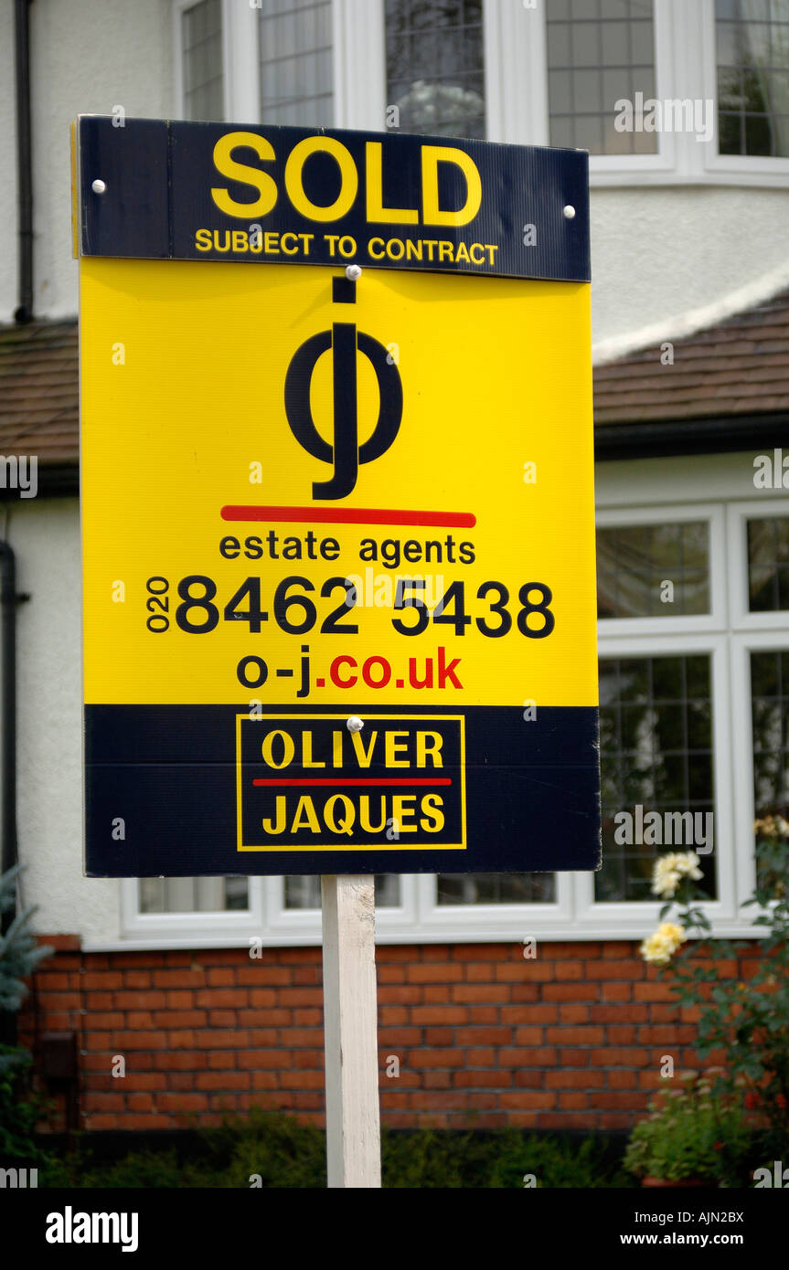 sold estate agent sign outside house london Stock Photo - Alamy