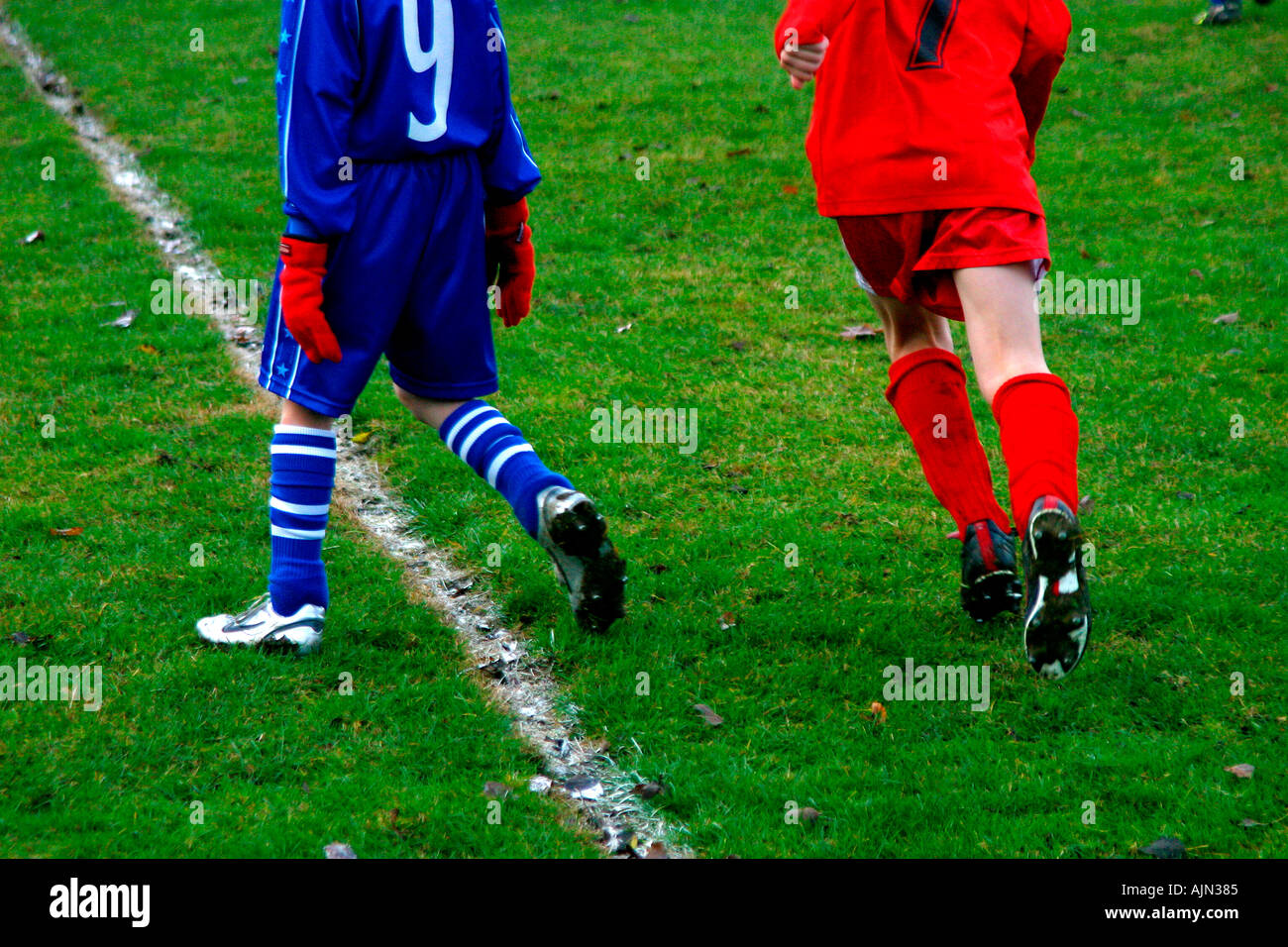 boy footballers on pitch Stock Photo - Alamy