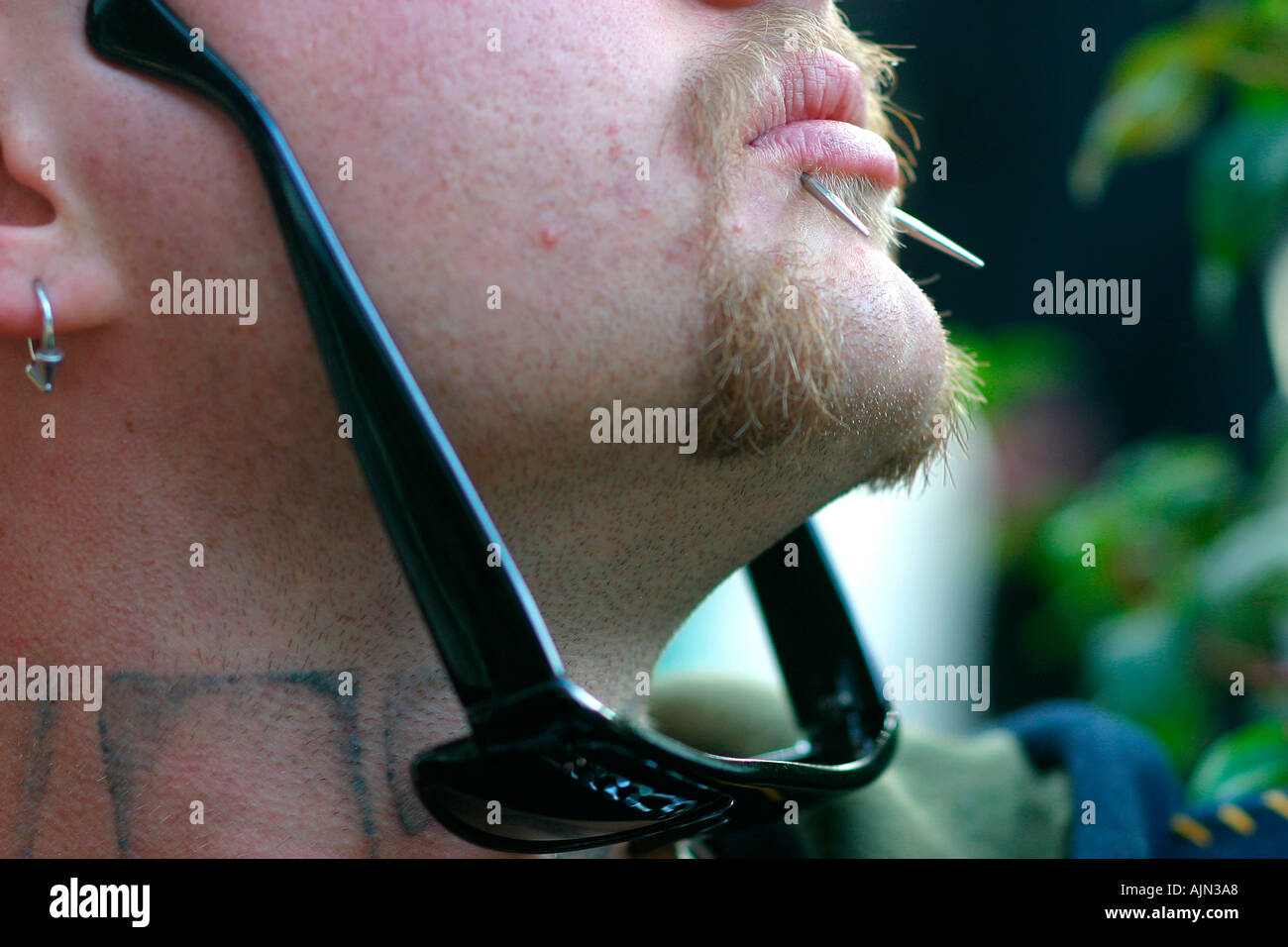 MAN WITH SUNGLASSES DANGLING FROM EARS Stock Photo - Alamy