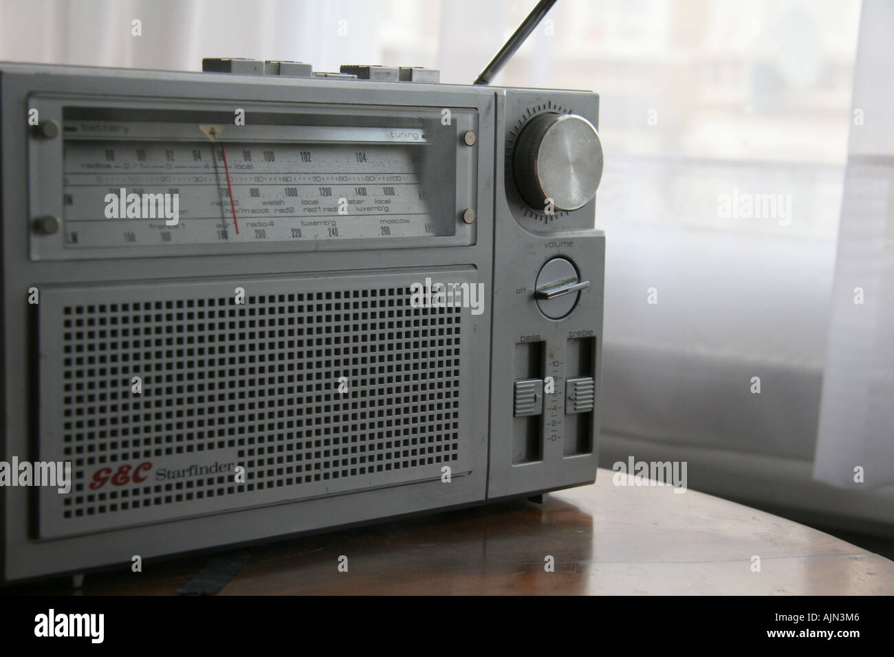 analogue radio on coffee table next to window Stock Photo - Alamy