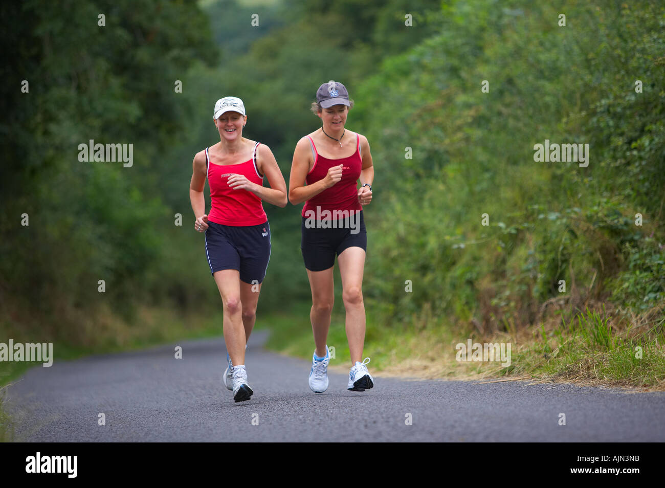 Two Women Jogging On Country High Resolution Stock Photography and ...