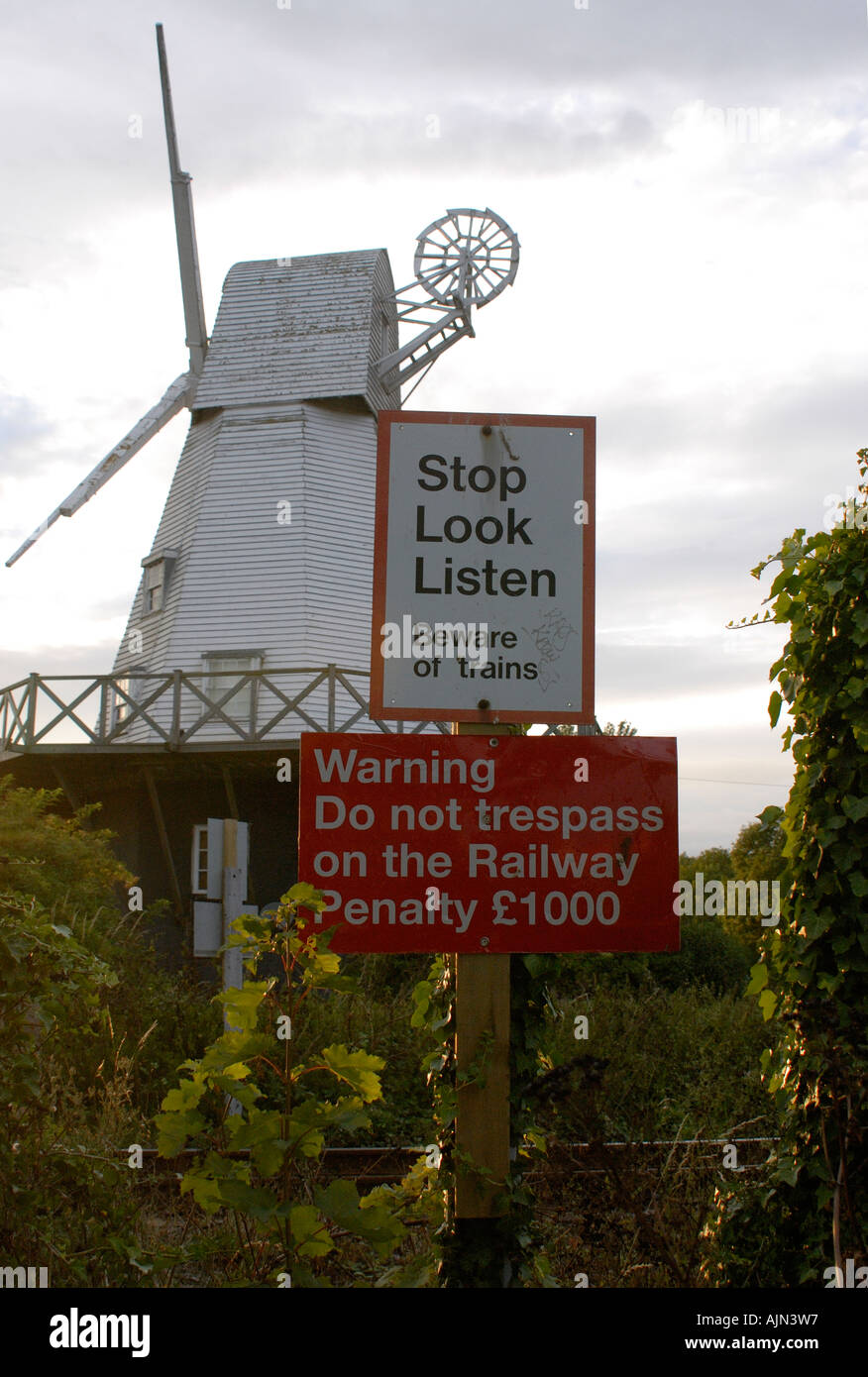 Stop Look and Listen sign on a railway crossing Also a red sign Warning ...