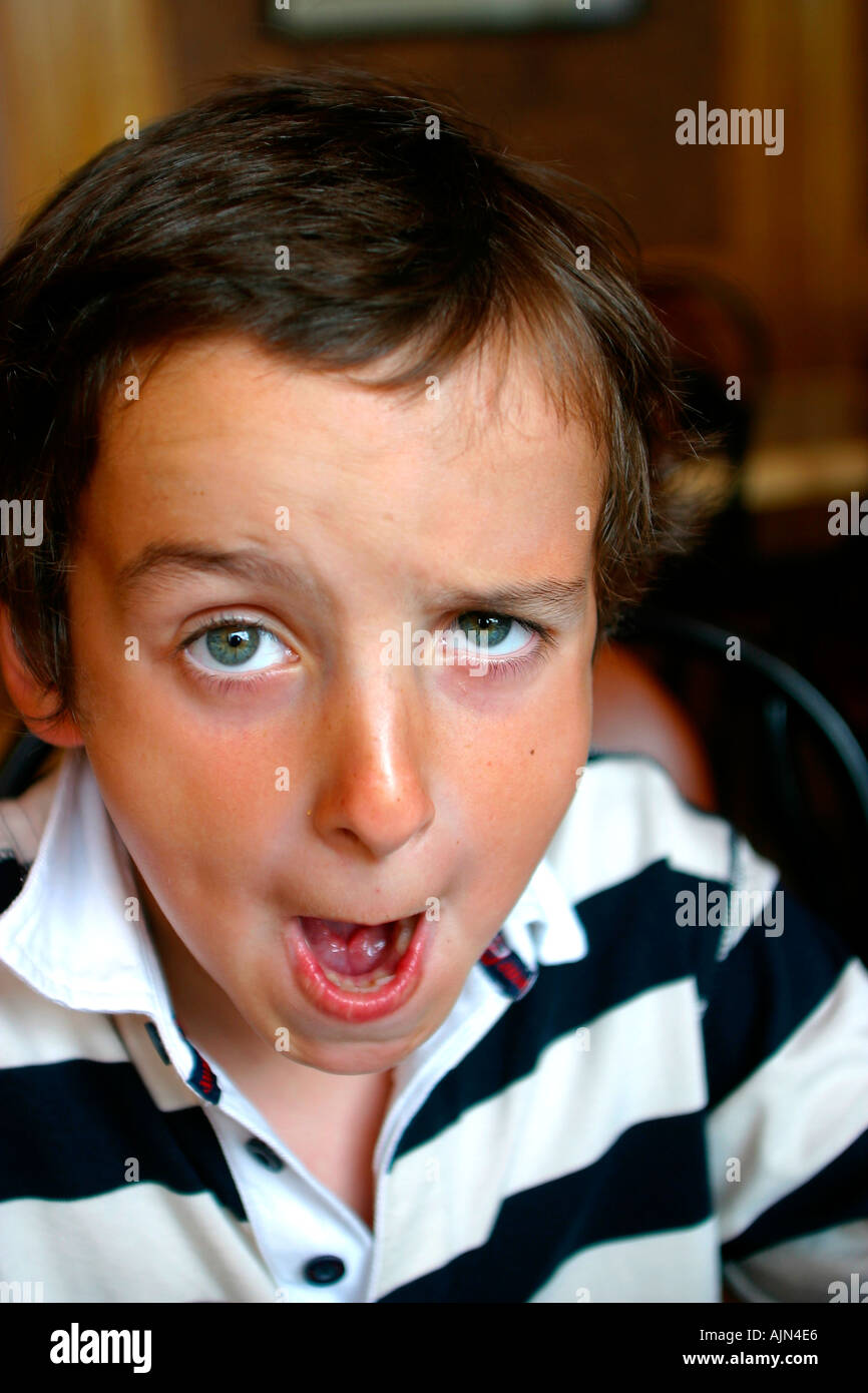 BOY PULLING A FACE Stock Photo - Alamy