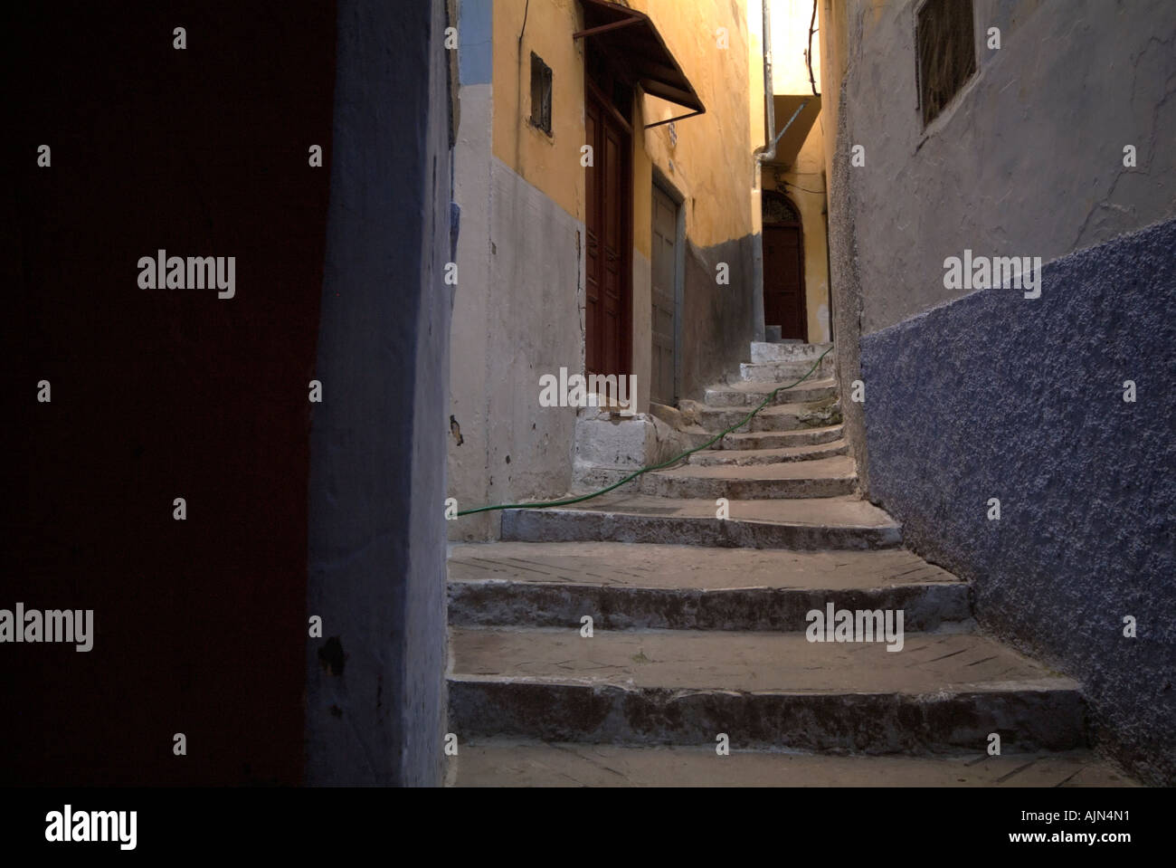 A deserted narrow flight of steps in the lanes of the Medina in the ...