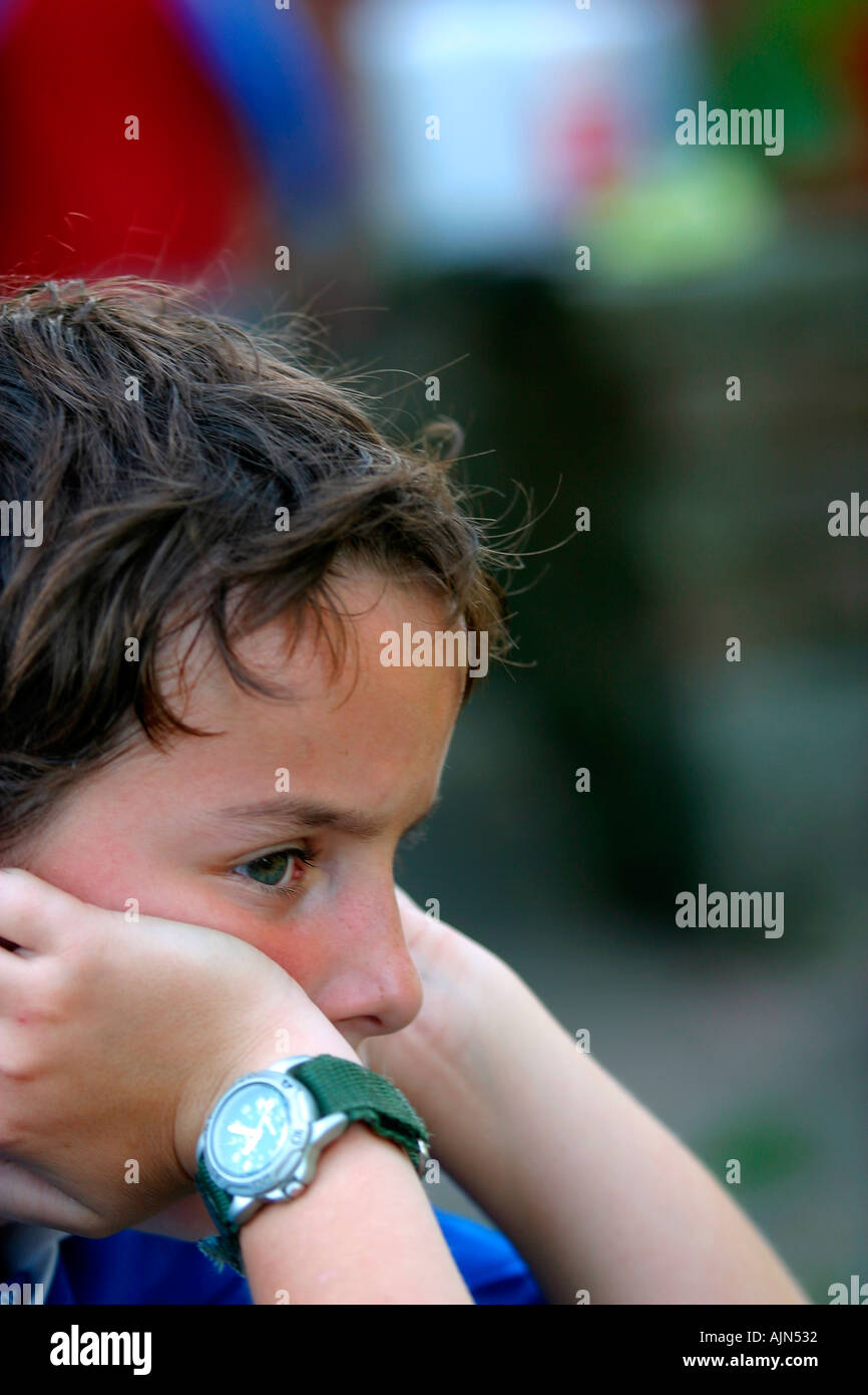BOY WITH HEAD IN HANDS Stock Photo - Alamy