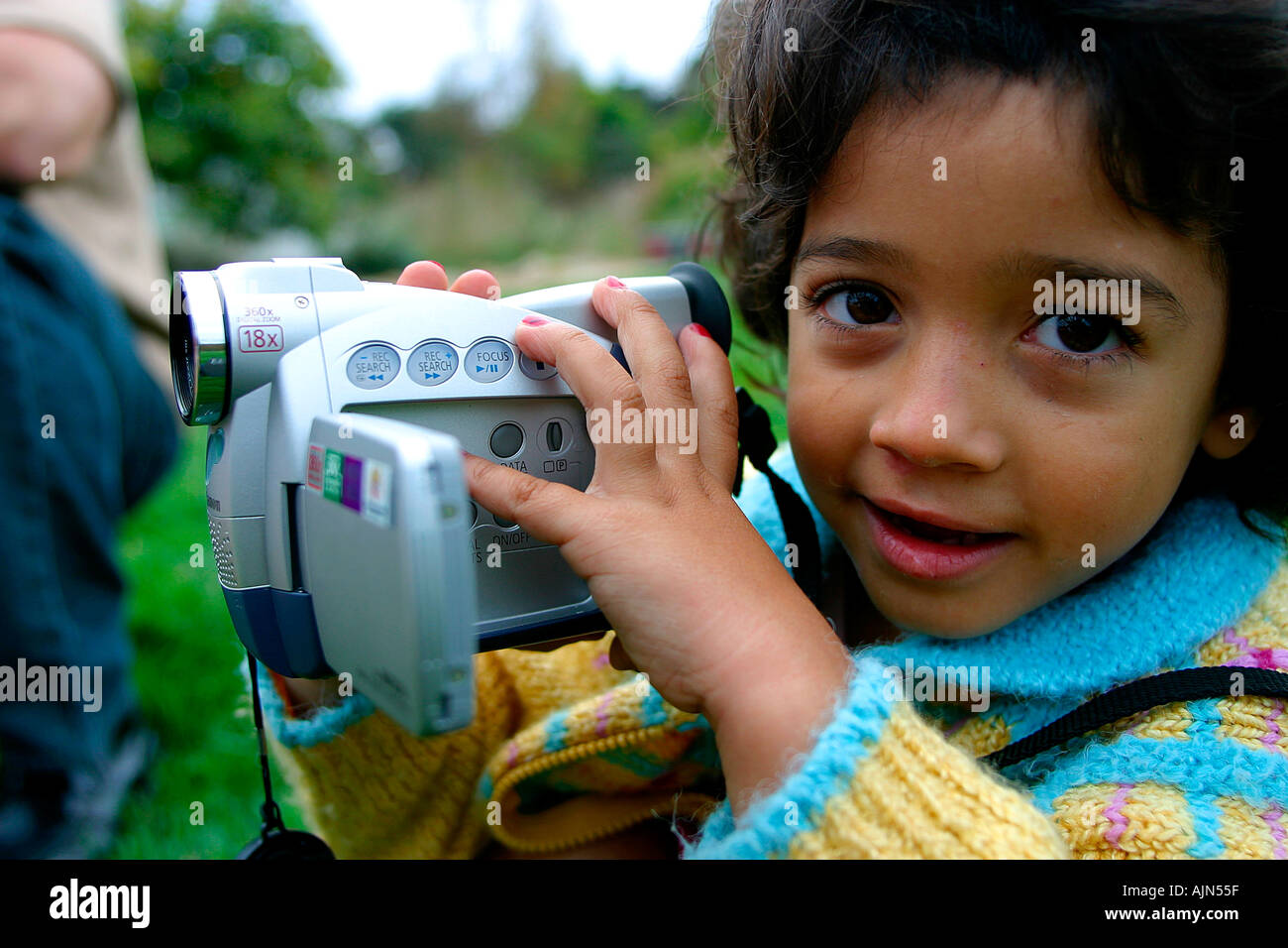 YOUNG GIRL WITH VIDEO CAMERA Stock Photo - Alamy