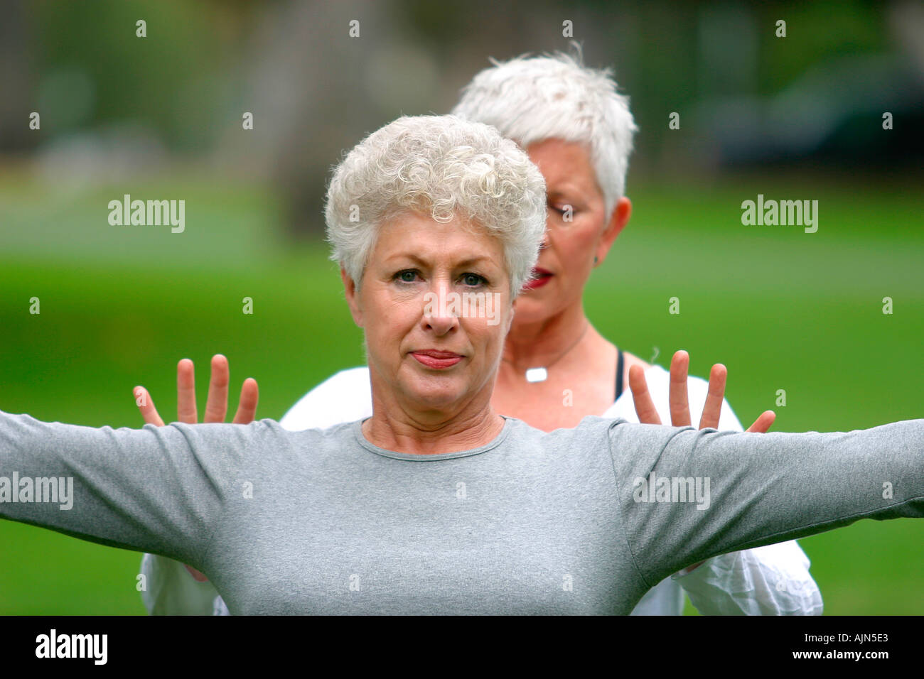 MIDDLE AGED WOMEN DOING YOGA EXERCISE Stock Photo - Alamy