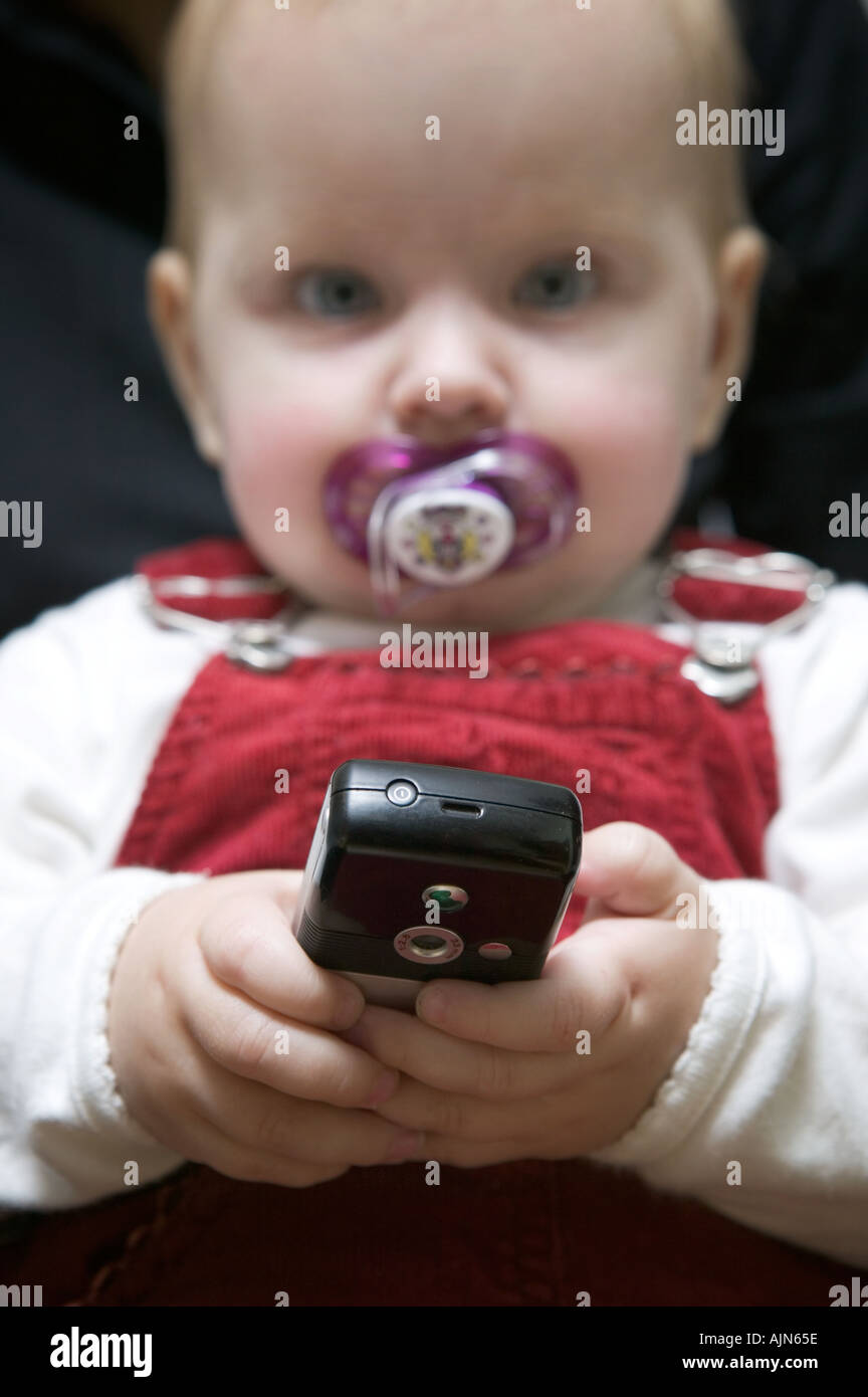 Baby with cell phone Stock Photo - Alamy