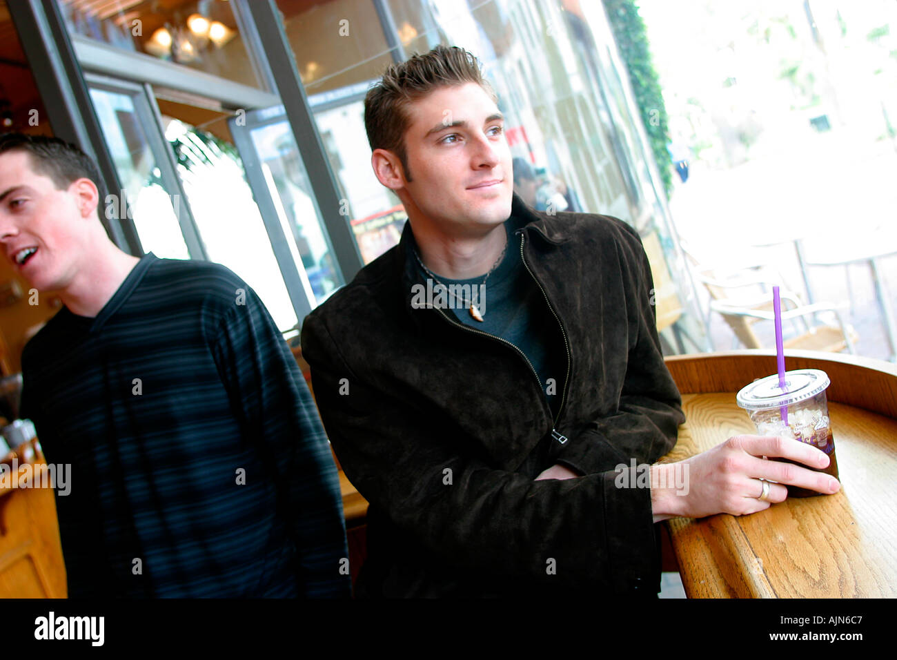 TWO YOUNG MEN IN A COFFEE SHOP Stock Photo - Alamy