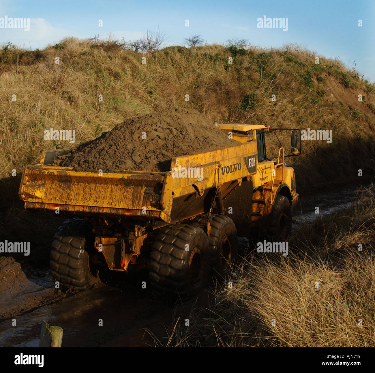 Sand being removed from the beach at Southport, UK Stock Photo - Alamy