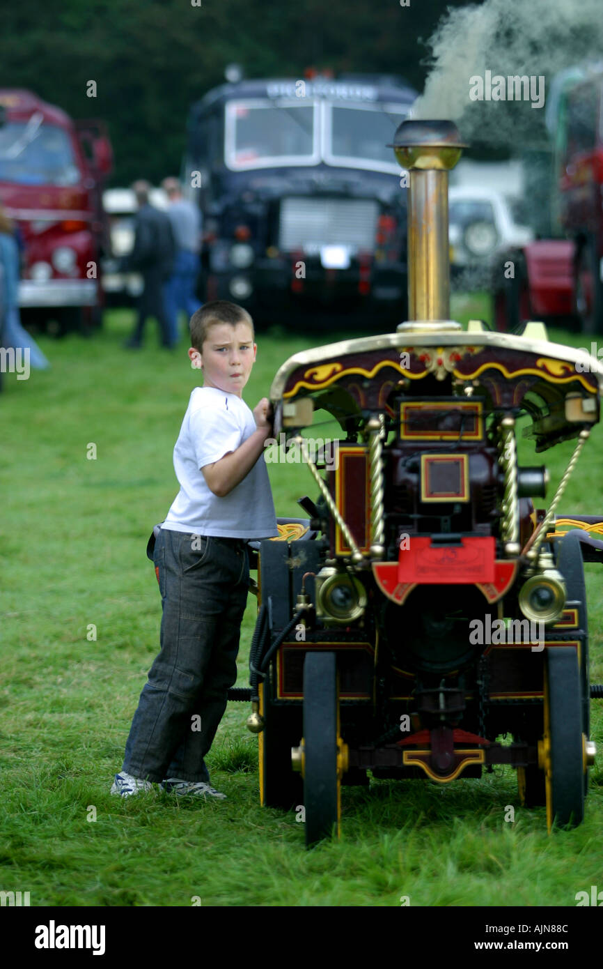 BOY WITH VINTAGE STEAM ENGINE Stock Photo - Alamy