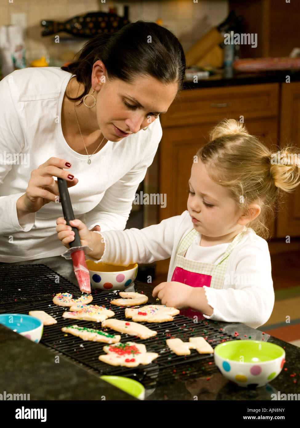 Mother and daughter baking Christmas cookies Stock Photo - Alamy