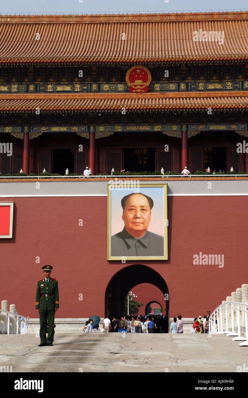 A soldier and portrait of Chairman Mao Zedong outside of the perimeter ...