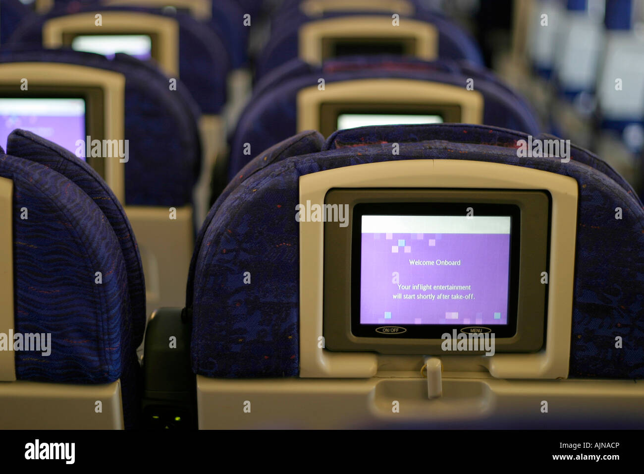 Row of seats and entertainment system of a commercial airplane Stock ...