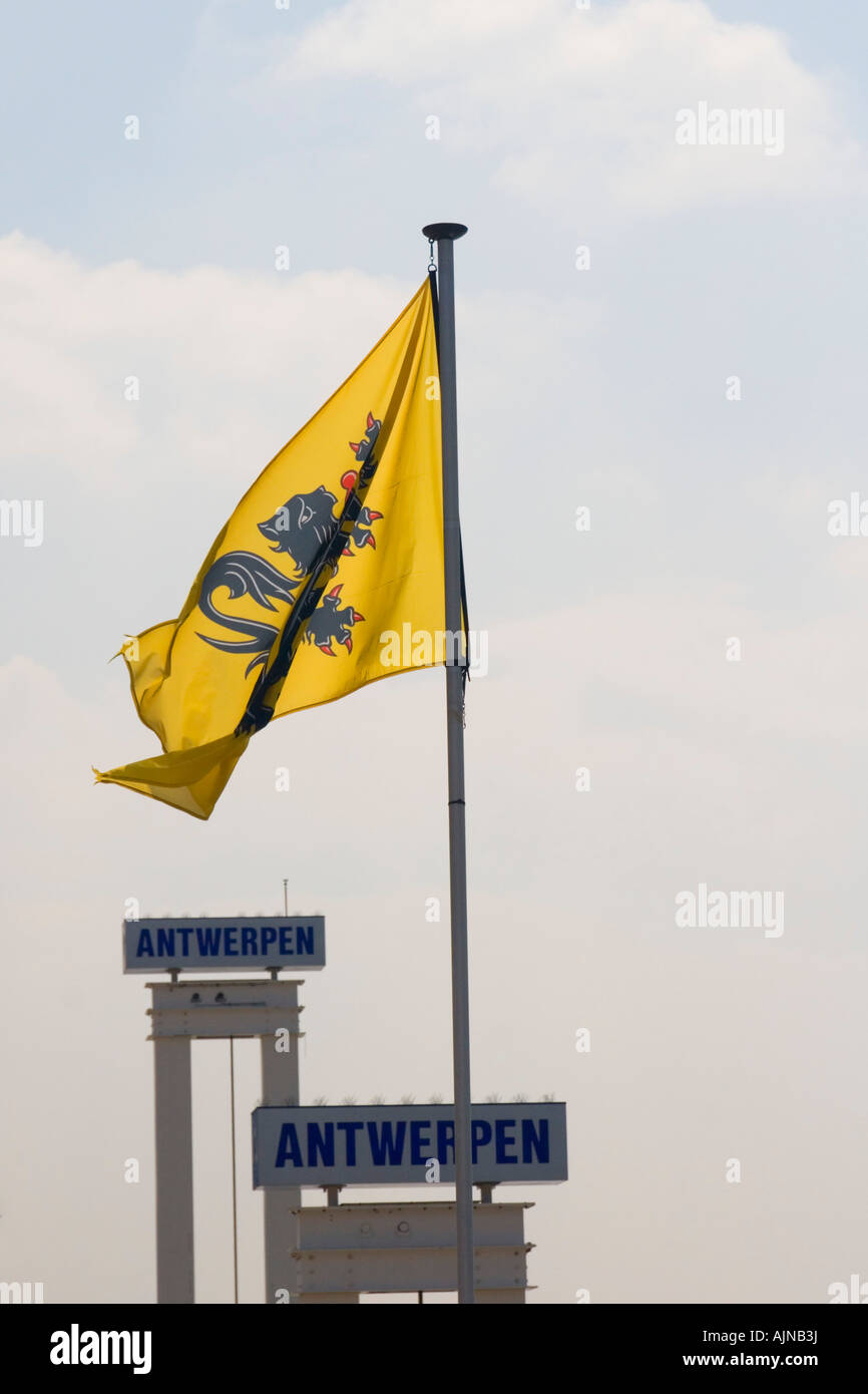 Flemish flag flying over Antwerpen sign in Antwerp port Belgium Stock ...