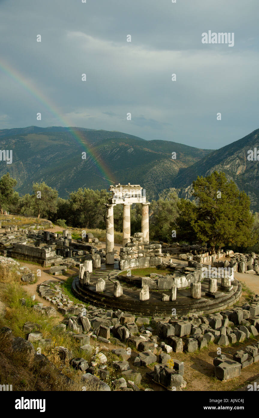 The Tholos Temple Sanctuary of Athena ruins with rainbow in Delphi ...