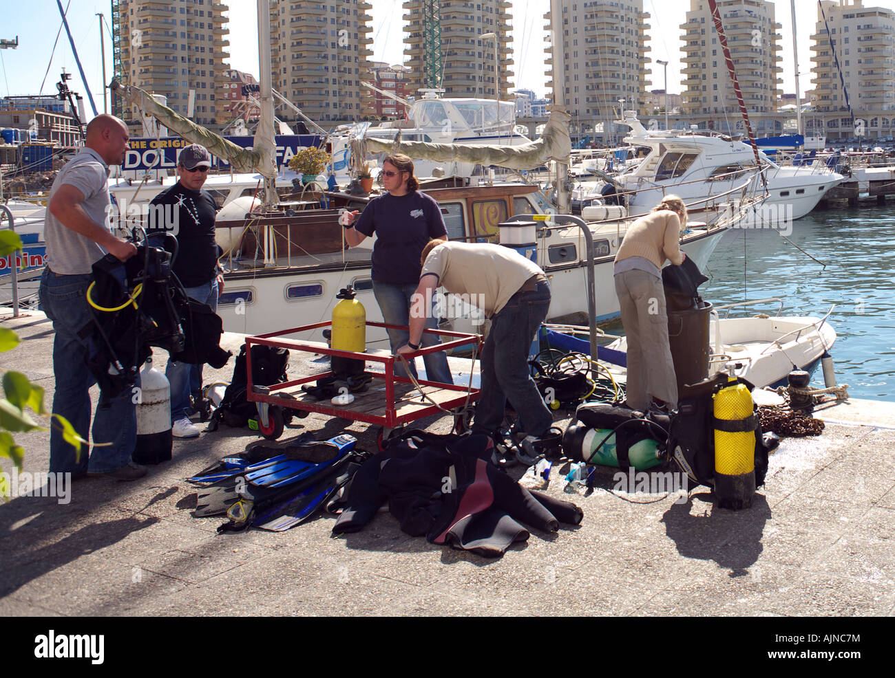 Divers preparing gear, Marina Bay, Gibraltar Stock Photo - Alamy