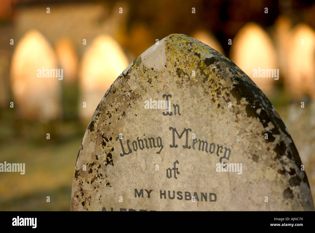 A gravestone in an English graveyard Stock Photo - Alamy