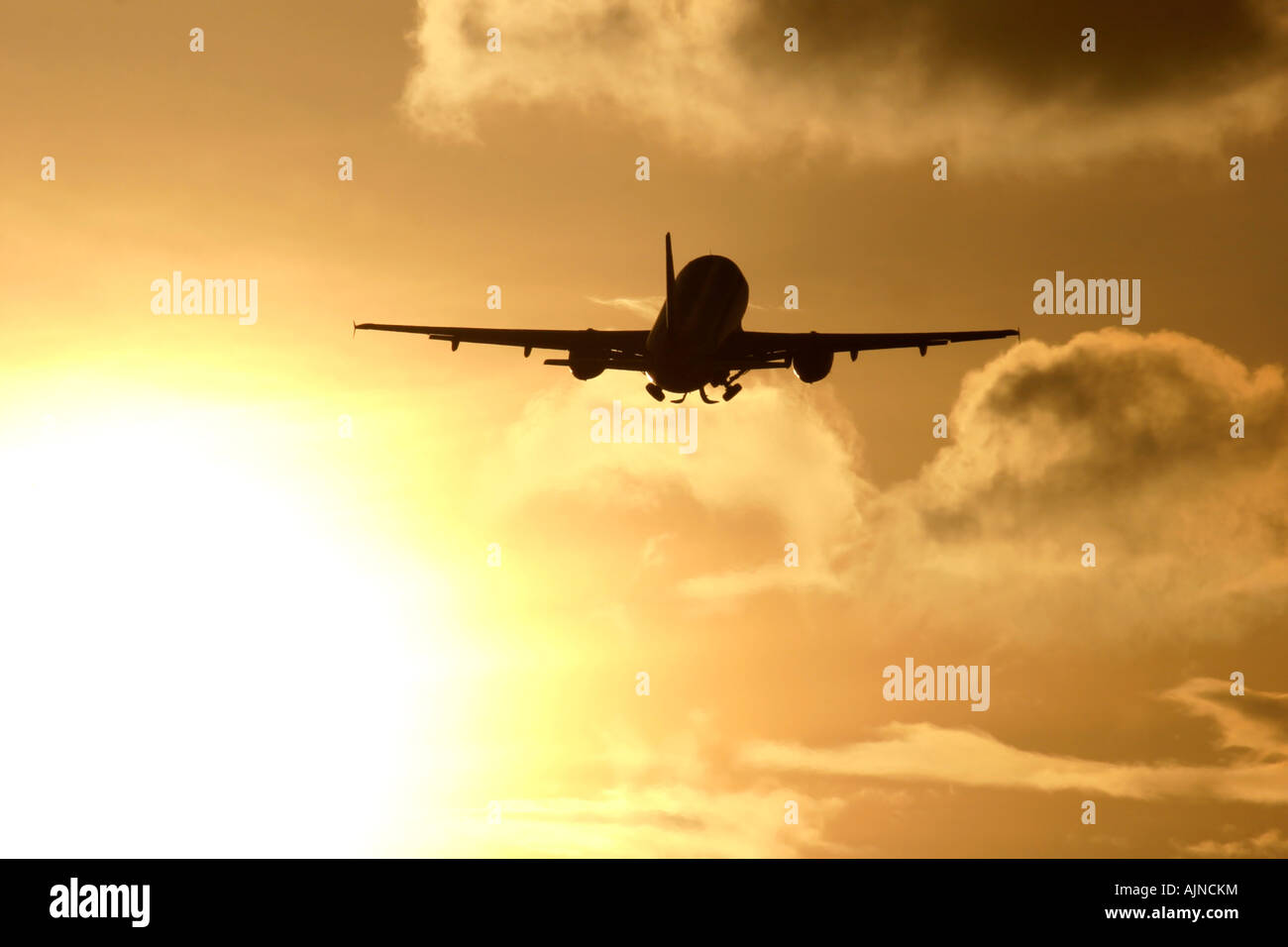 Commercial airplane during flight in clouds Stock Photo - Alamy