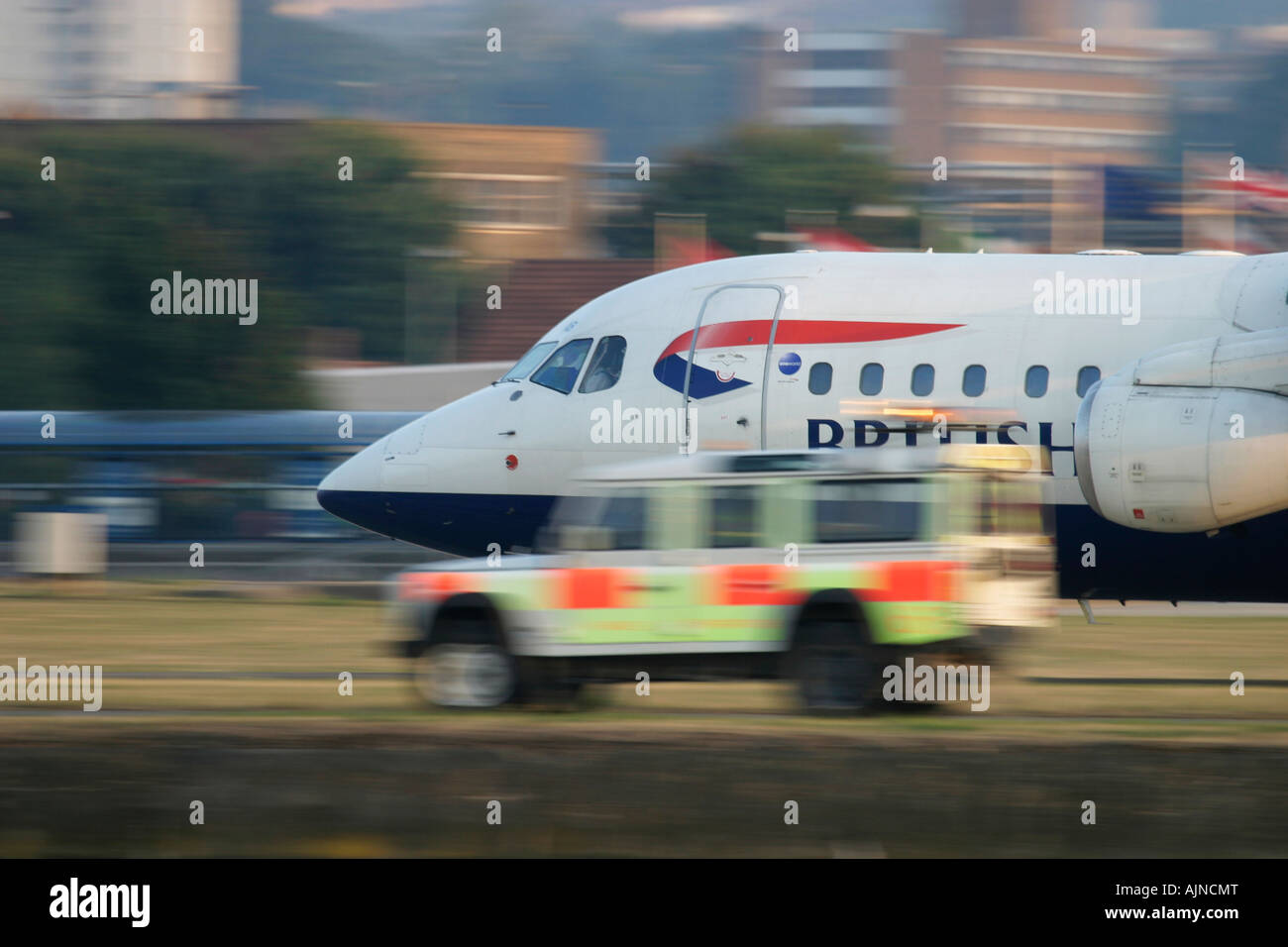 British Airways commercial jet passing behind ground crew Land Rover ...