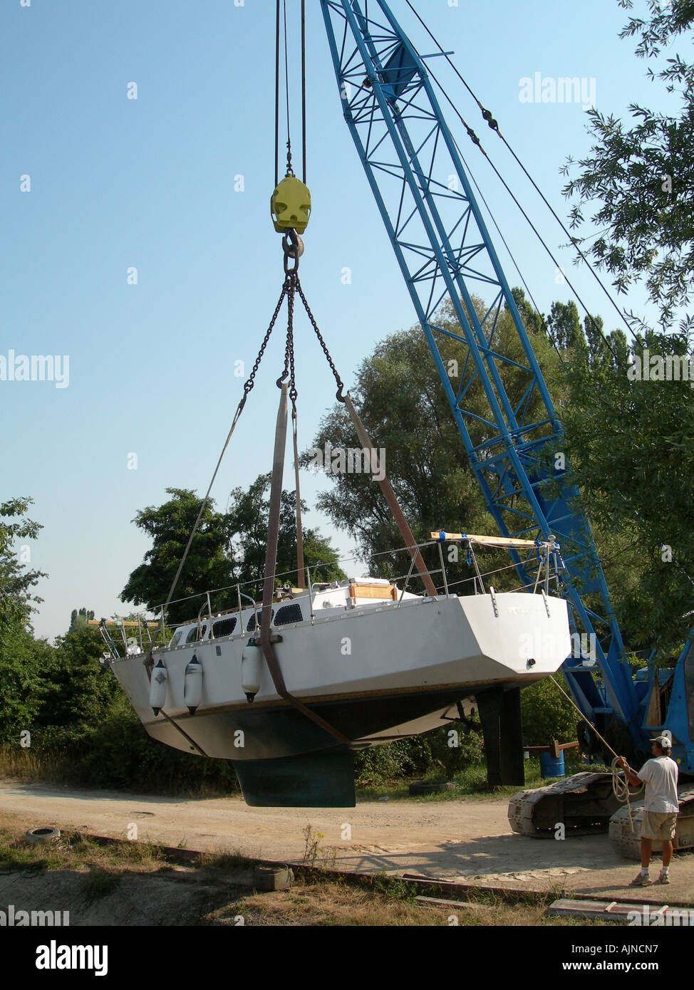 hub lift boat dry dock crane out of water Stock Photo - Alamy