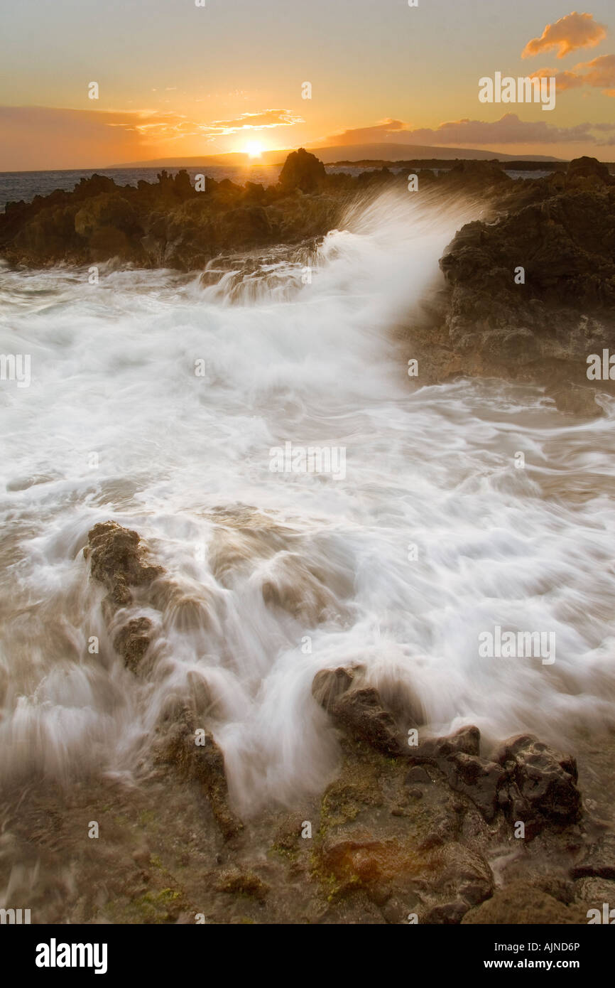 Sea waves breaking over rocks Stock Photo - Alamy