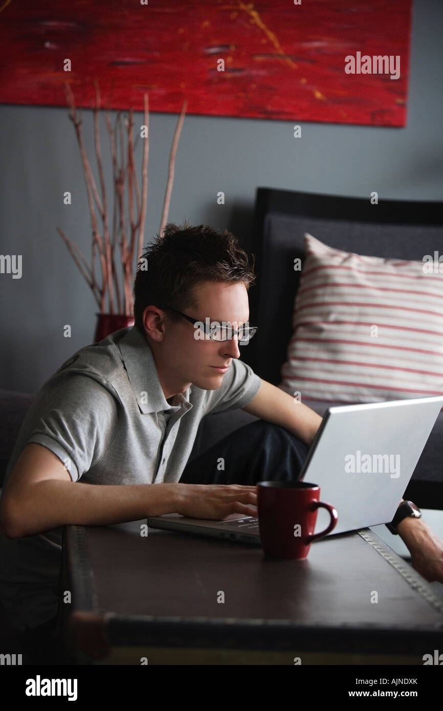 A man working on laptop Stock Photo - Alamy