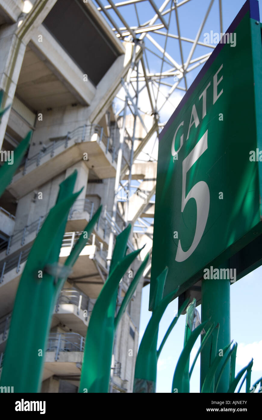 Above a green painted fence, this sign marks gate number 5 on the east ...