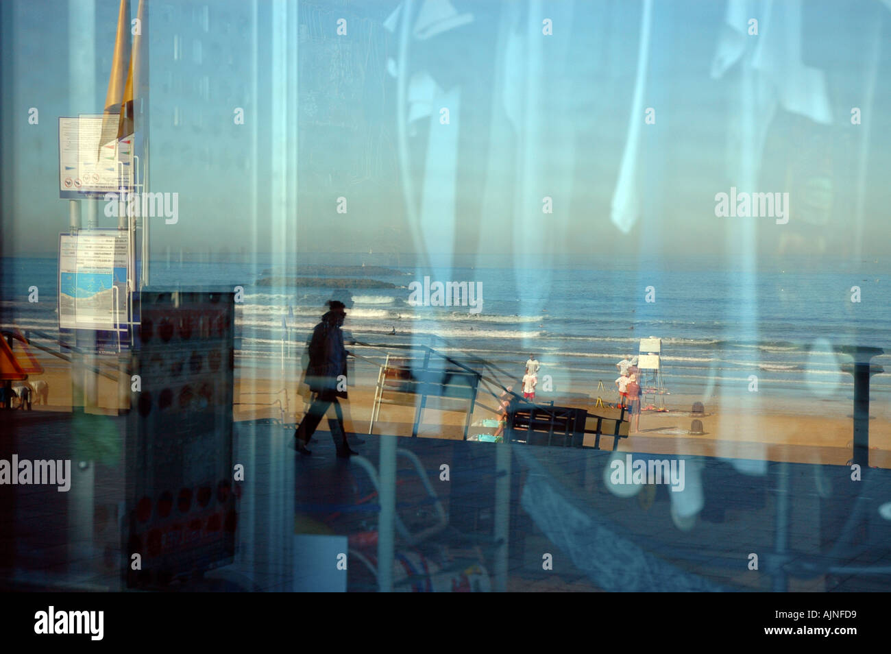 Biarritz Grand Plage reflected in surf shop window Stock Photo - Alamy