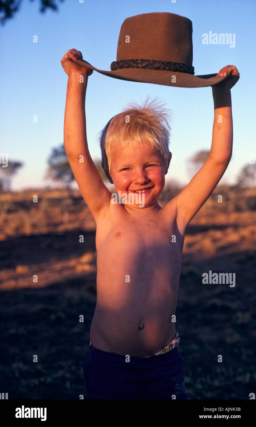 Australian boy with akubra hat Northern Territory Australia vertical ...