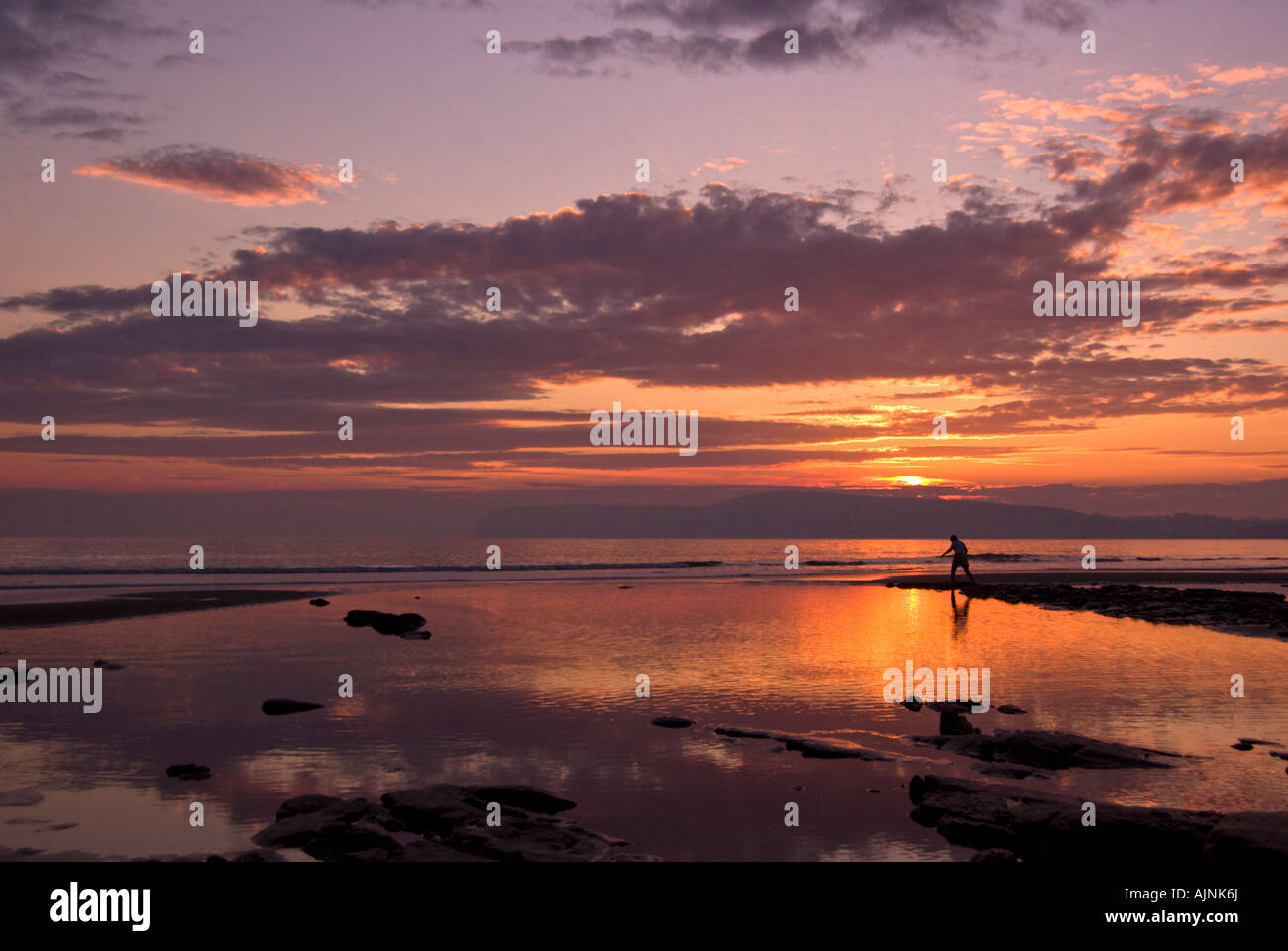 Exploring the beach at sunset at Compton on the Isle of Wight Stock ...