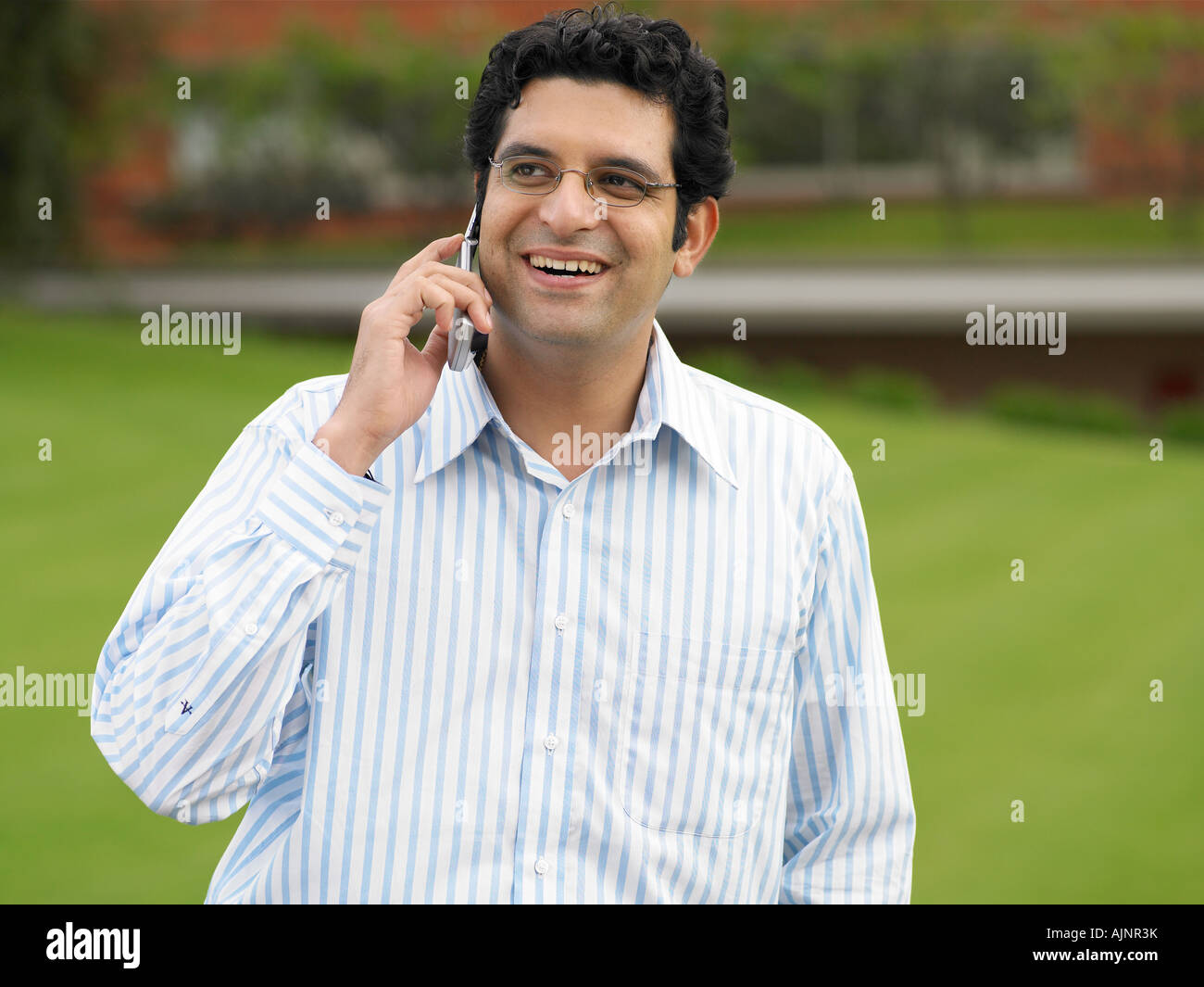 Man talking over mobile indian hi-res stock photography and images - Alamy