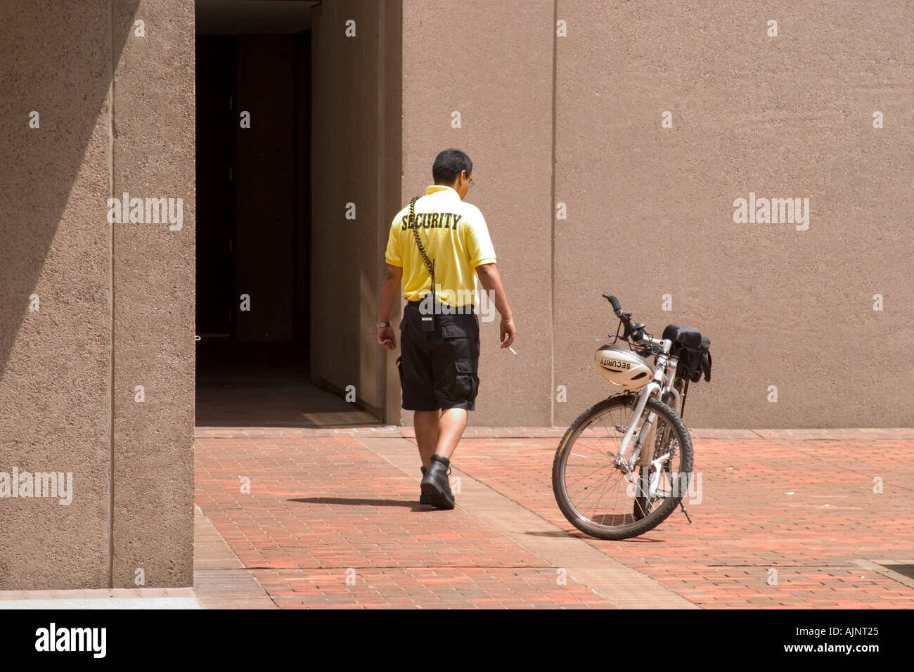 Security guard near his bicycle Stock Photo - Alamy