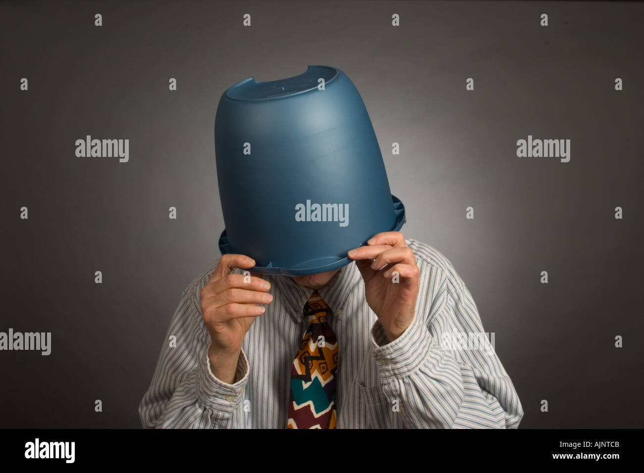Man bucket covering head hi-res stock photography and images - Alamy