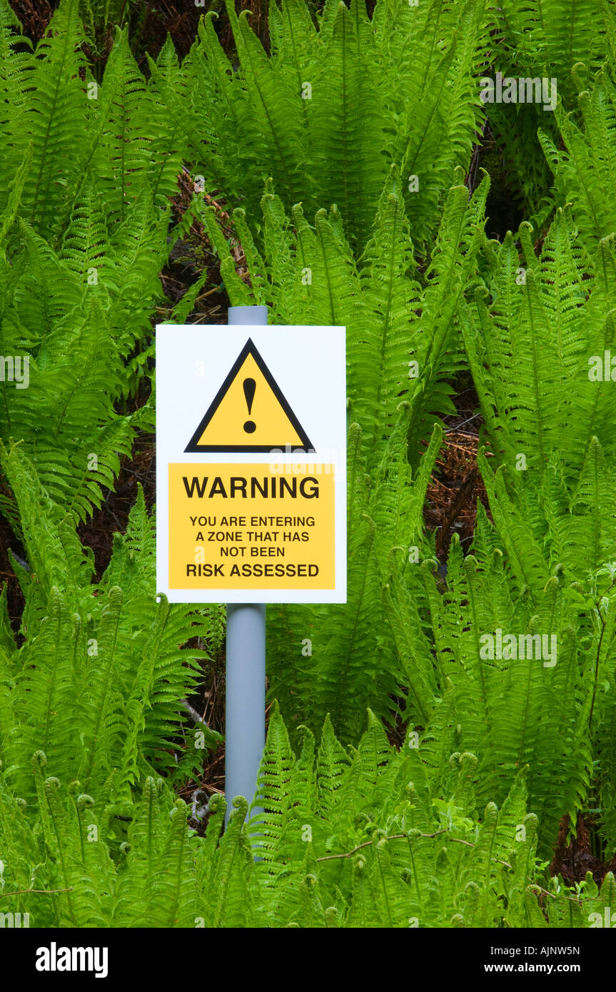 Spoof hazard sign in the forest Stock Photo - Alamy