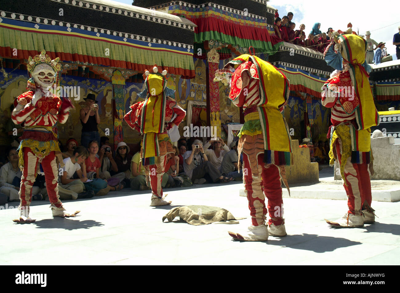 Cham dance - traditional tibetan buddhist monks dance in masks and ...